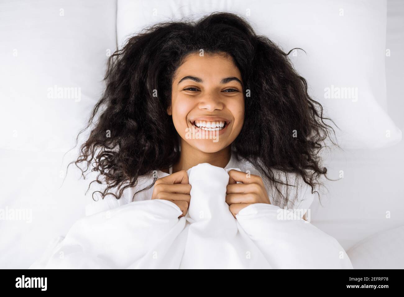 African american woman waking up in bed hi-res stock photography and ...