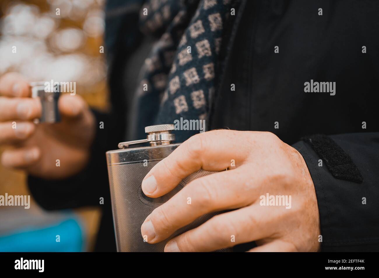 Male hand holding hip flask hi-res stock photography and images - Alamy