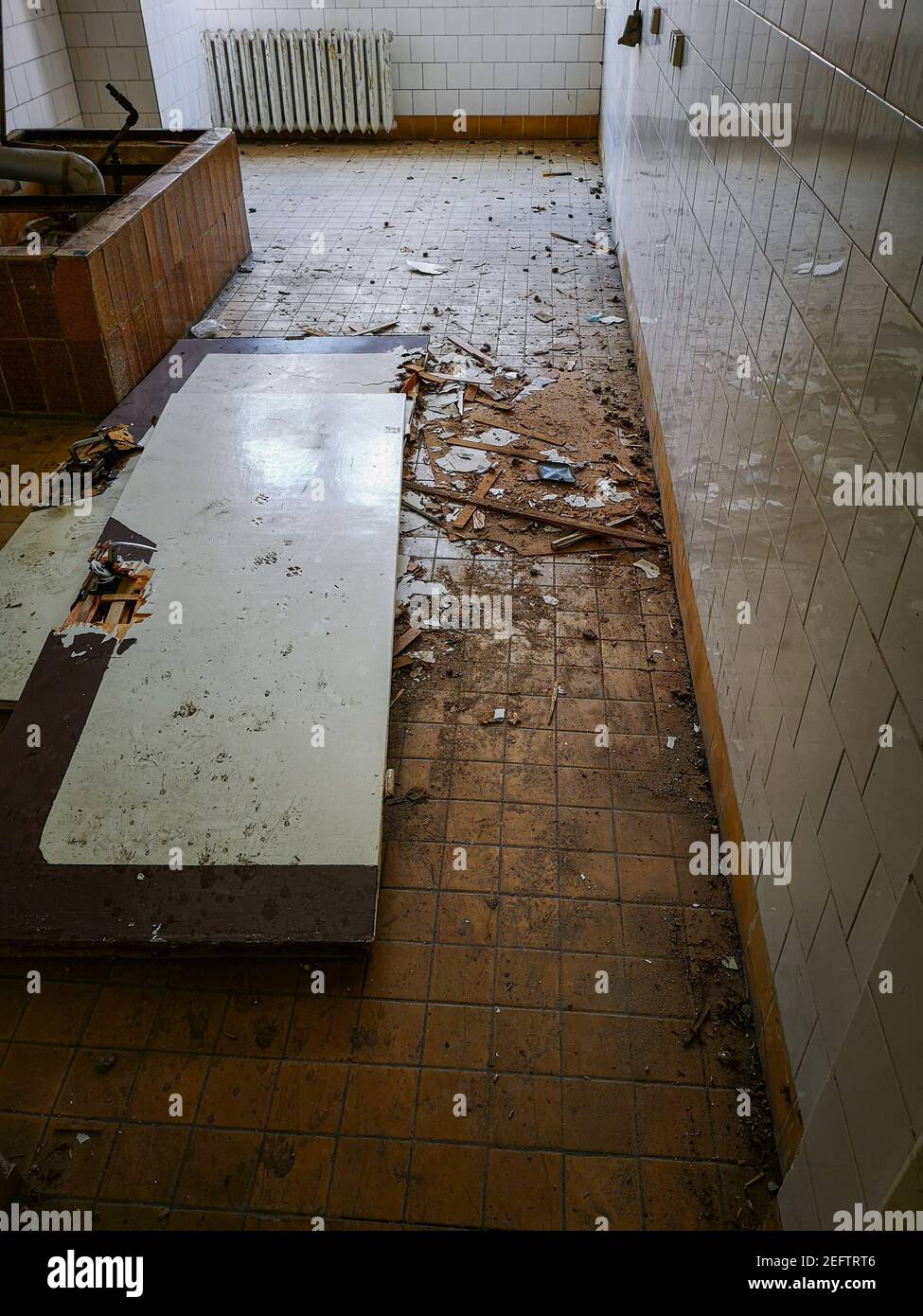 Old wooden hospital doors lying on the ground in old abandoned hospital ...