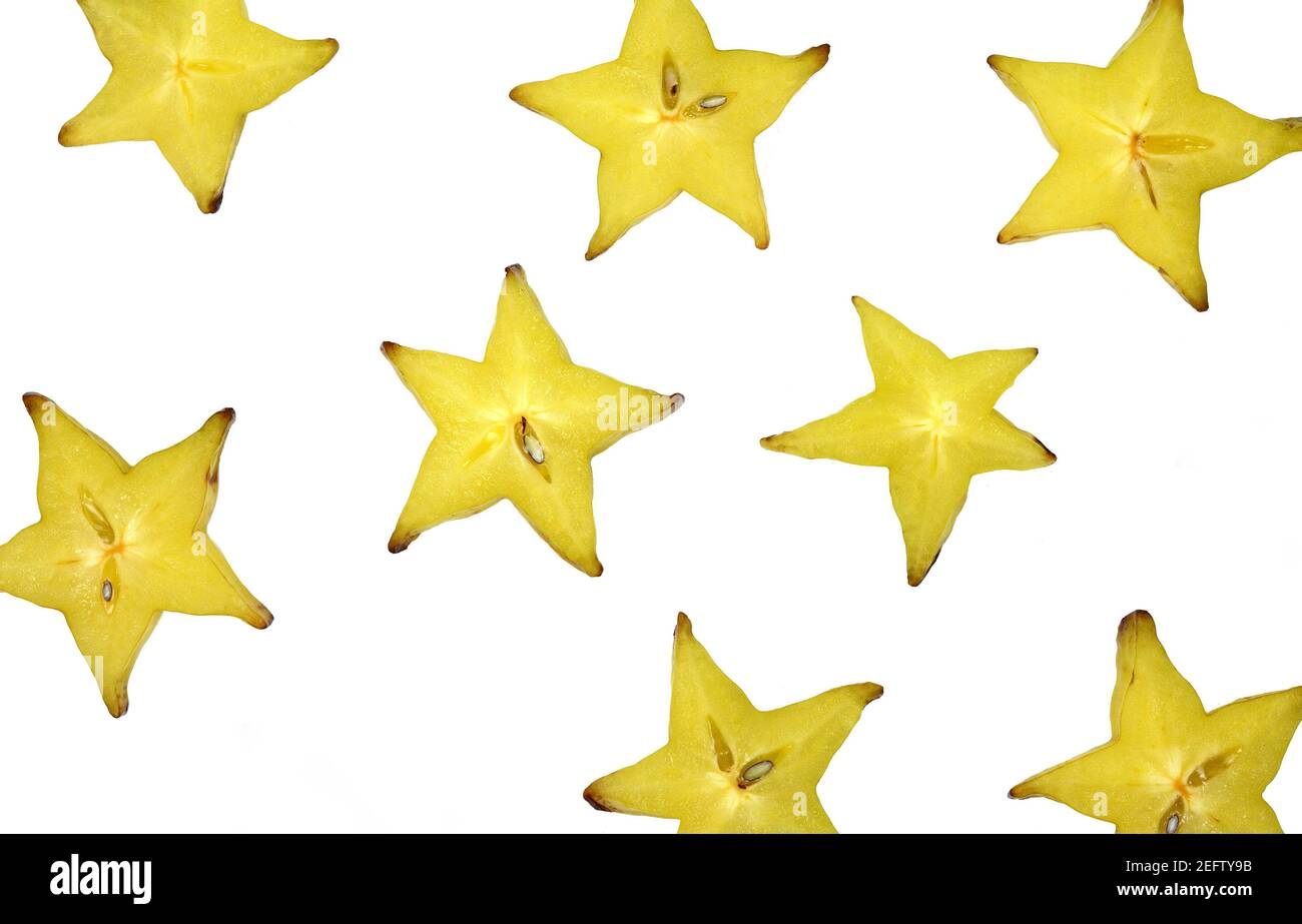 Star shaped slices of carambola fruit isolated on white background ...
