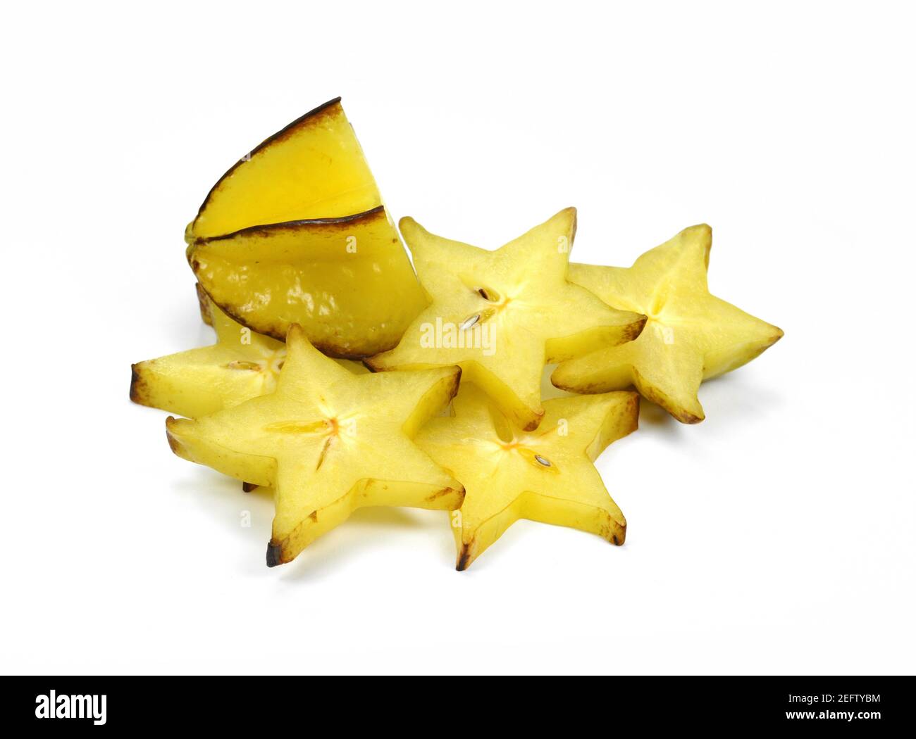 Star shaped slices of carambola fruit isolated on white background ...
