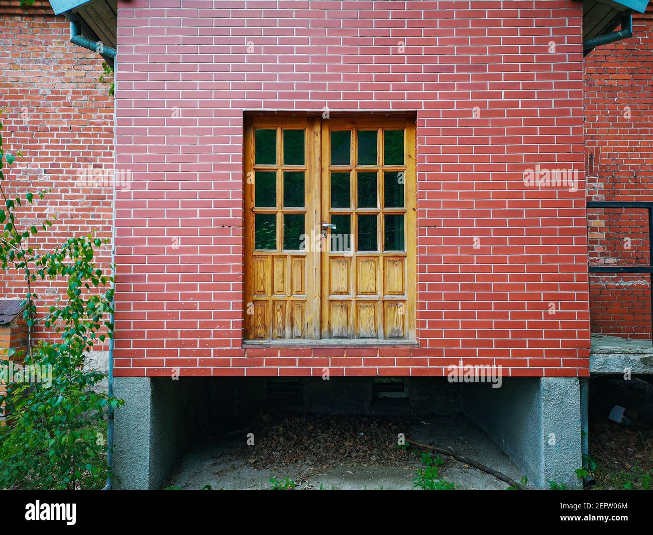Doors on mezzanine without stairs for unwanted guests Stock Photo - Alamy