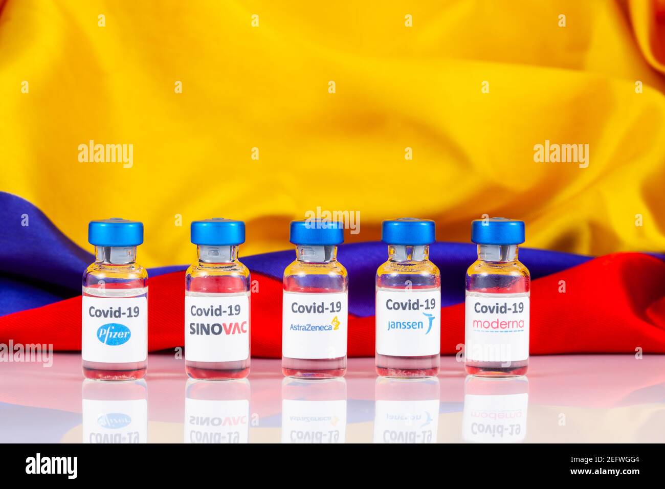 BOGOTA, COLOMBIA - FEBRUARY 2021. Vaccine vials and Colombian flag ...