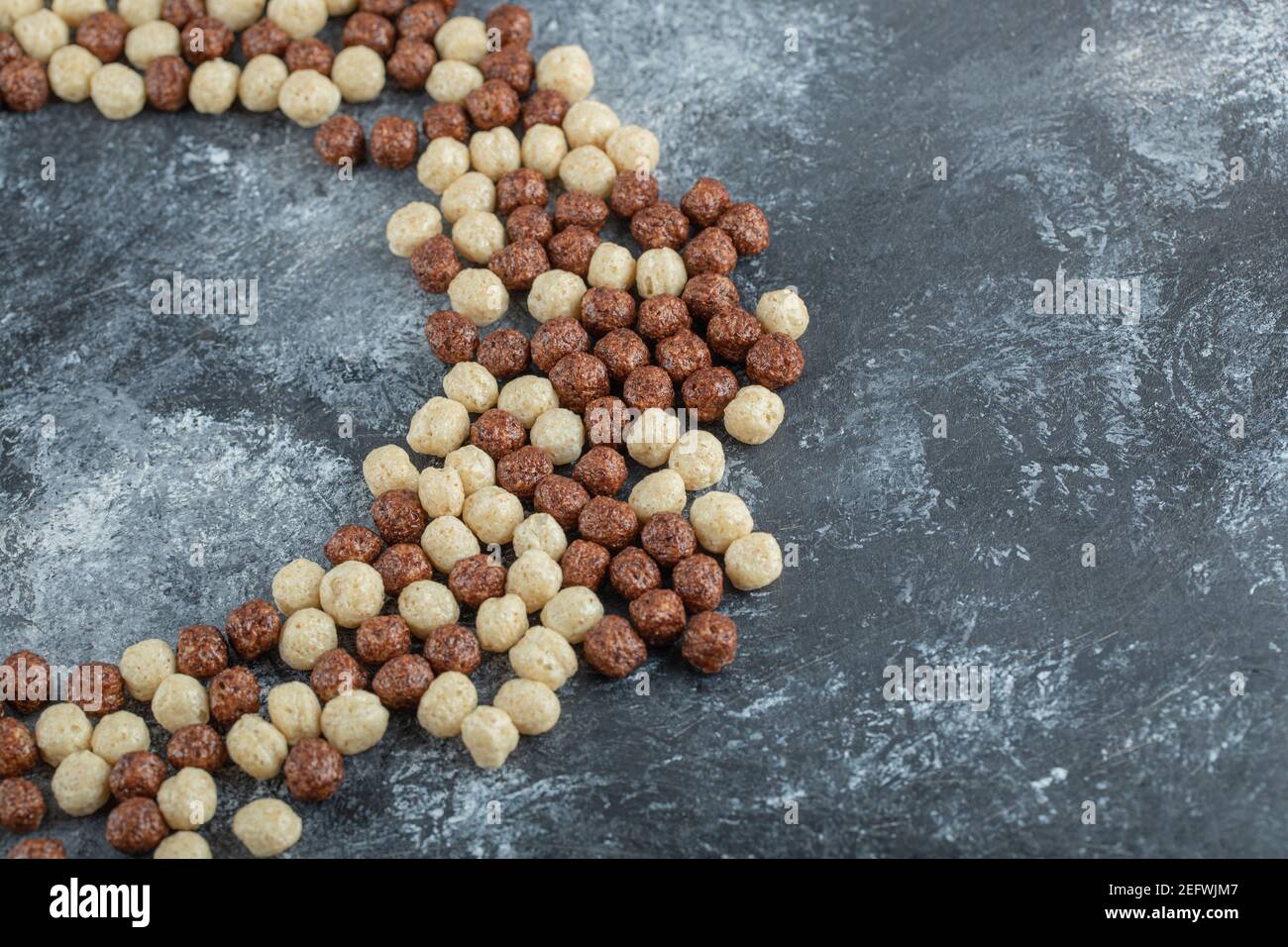 Circle of chocolate corn balls flakes on a gray background Stock Photo ...