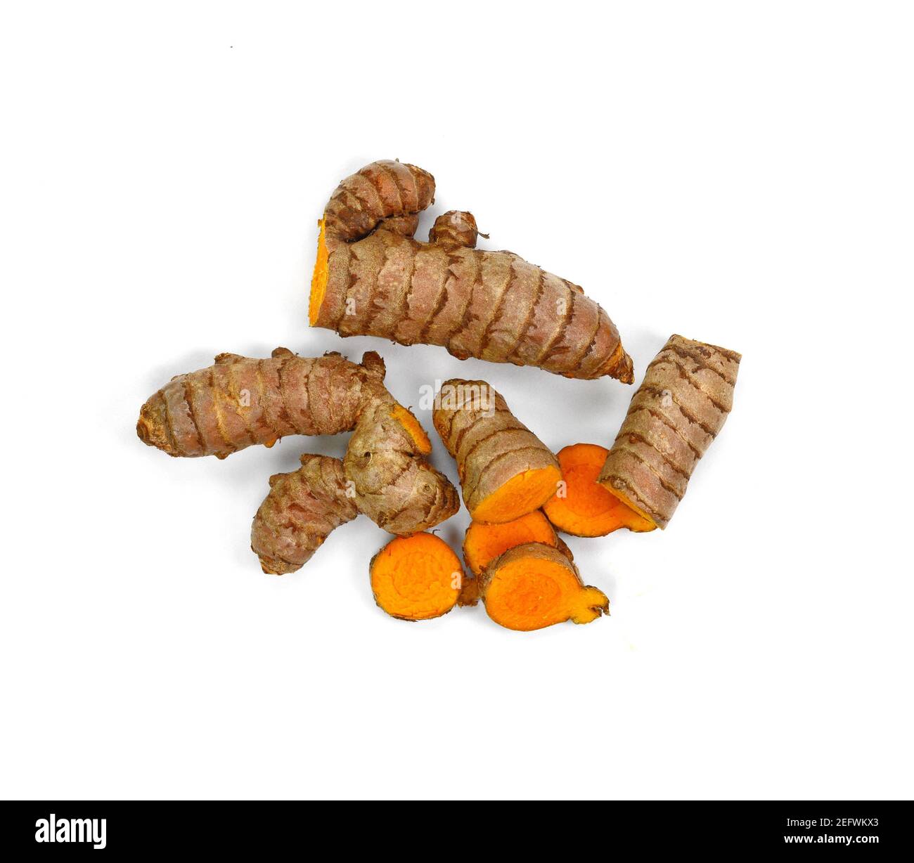 Fresh turmeric roots isolated on white background. Sliced fresh ...