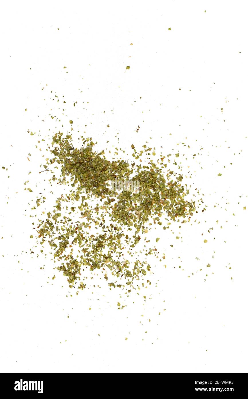 Dry marjoram spice (Origanum majorana). Heap of ground marjoram leaves ...