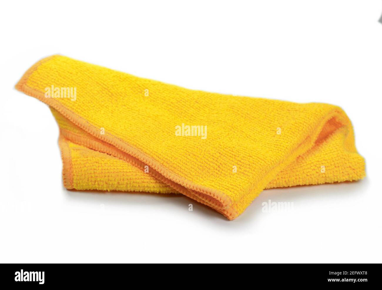 Yellow micro fiber towel isolated on white background. Clean, new ...