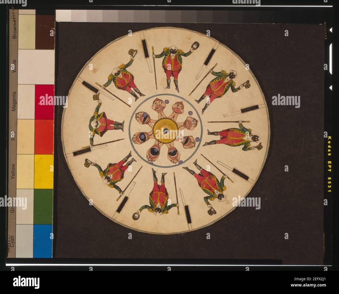 Optical illusion disc with a face catching a ball and a man with ...