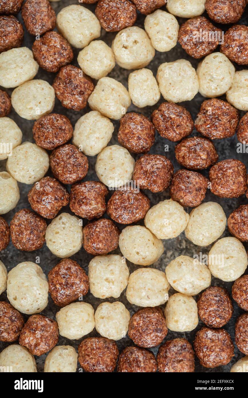 Chocolate corn balls flakes as a background Stock Photo - Alamy