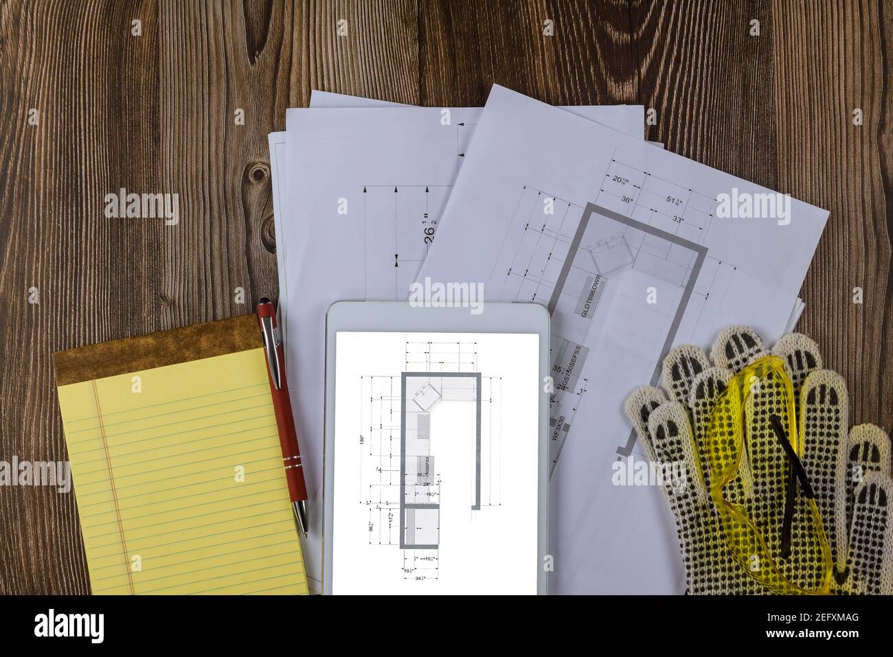 Construction site equipment on engineer a paper among working space ...