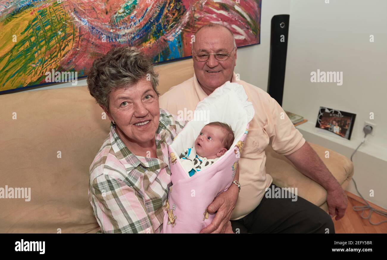 family portrait with grandparents parents and baby Stock Photo - Alamy