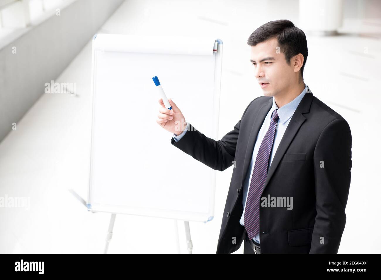 Young businessman as a meeting leader giving a presentation Stock Photo ...