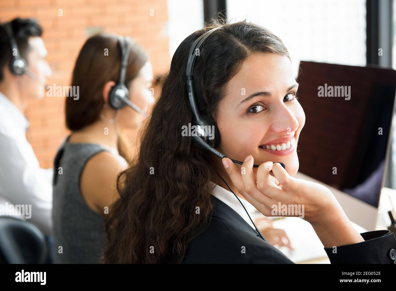 Smiling beautiful woman working in call center Stock Photo - Alamy