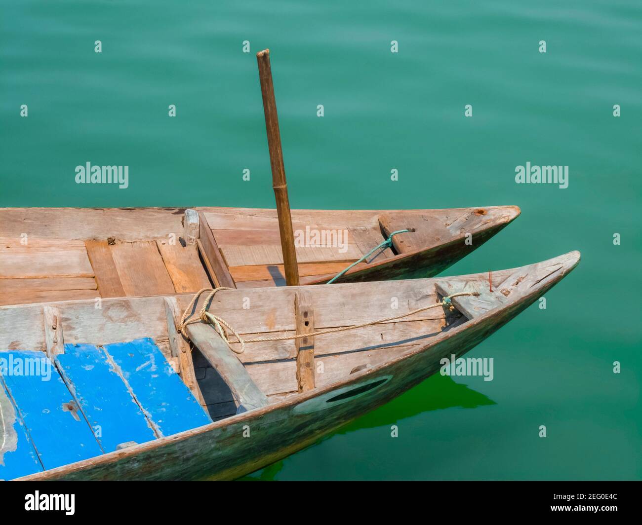 Pair of traditional wooden Vietnamese sampan rowboats on water Stock ...