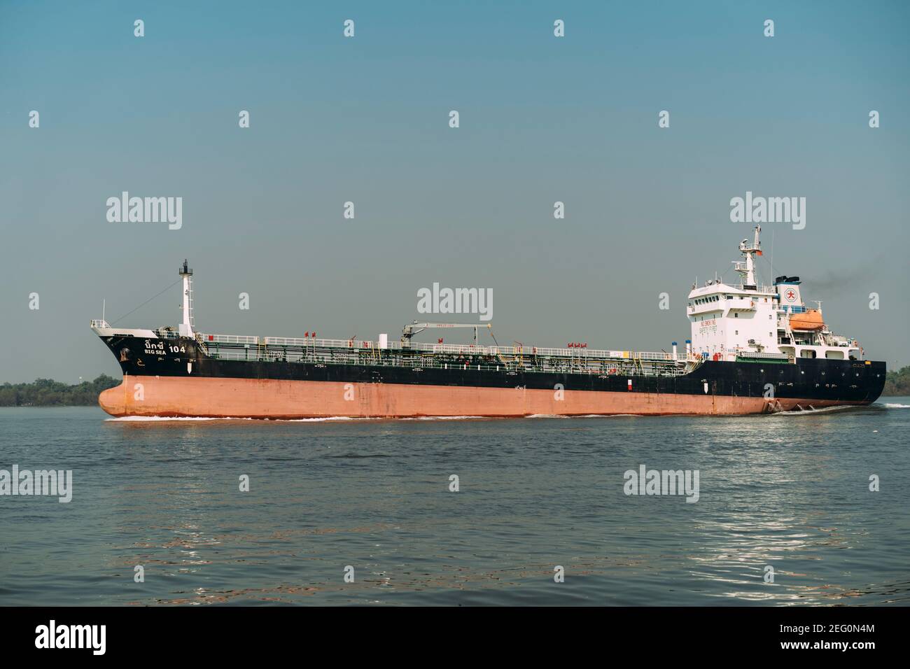 Big, empty shipping container ship going up Chao Praya River in Pak Nam ...
