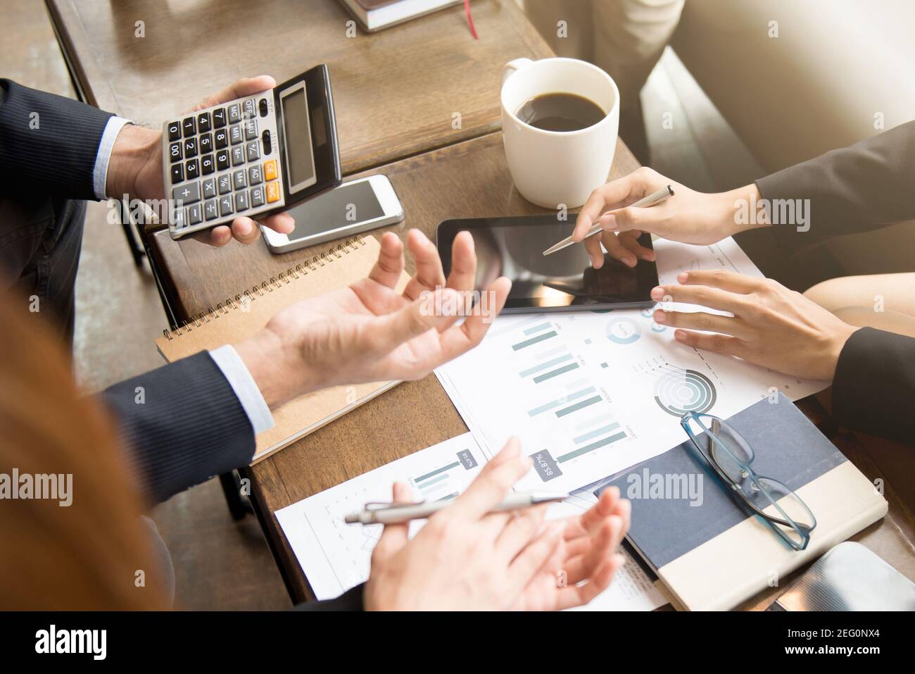 Financial adviser working with clients, calculating and analyzing data ...