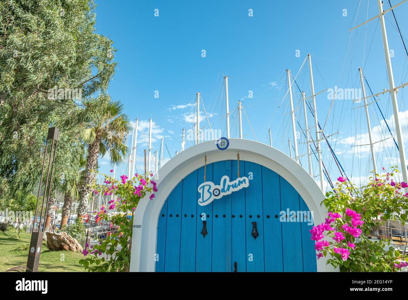 Symbolic blue door with the name of the city of Bodrum, sail masts and ...