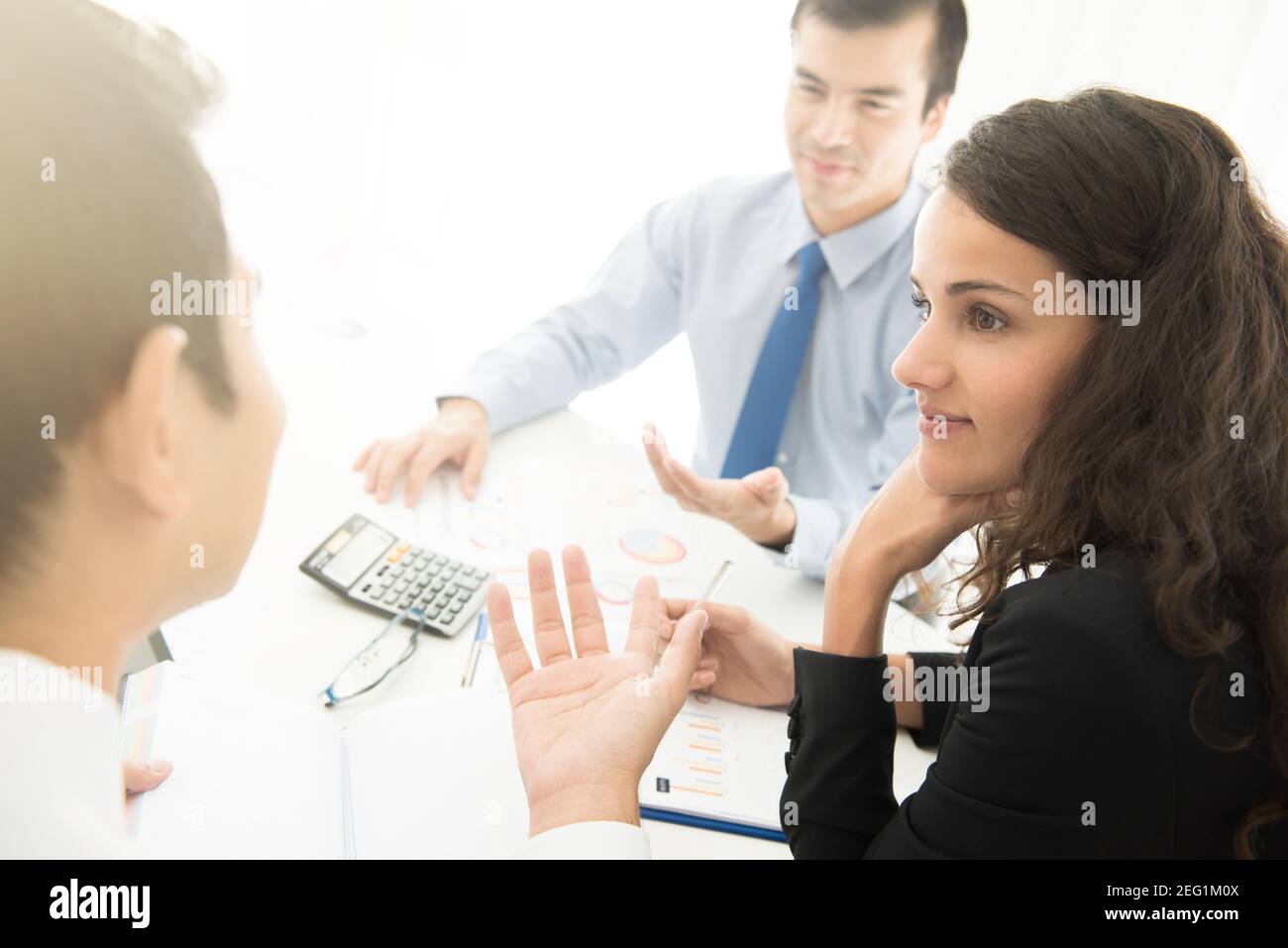 Business people consulting and discussing work at meeting table Stock ...