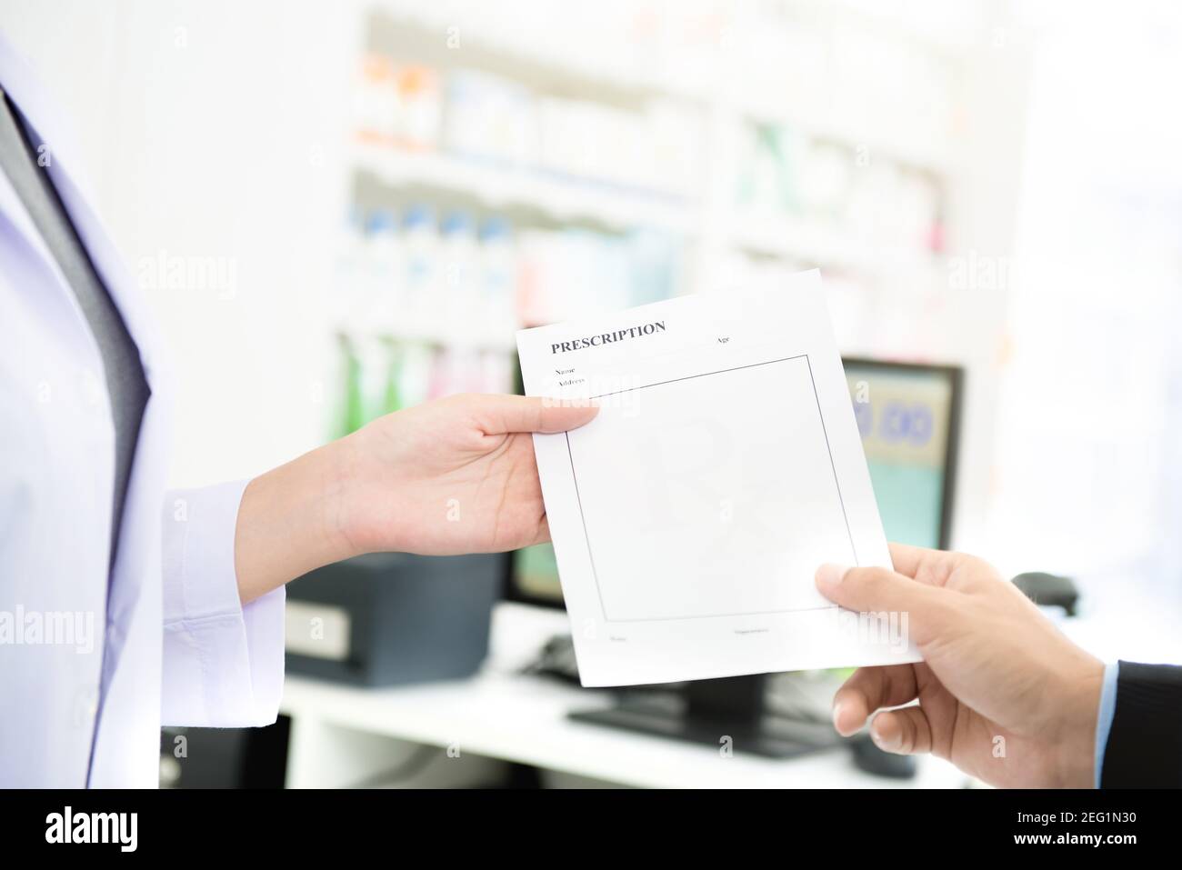 Customer (patient) giving prescription to pharmacist in pharmacy Stock ...