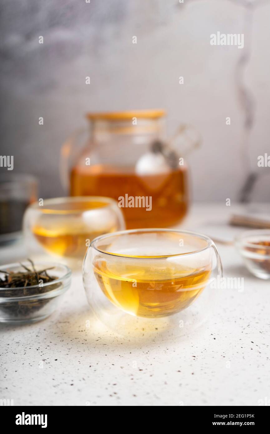 light tea flatley. pour black tea into thermos cups, on a light ...