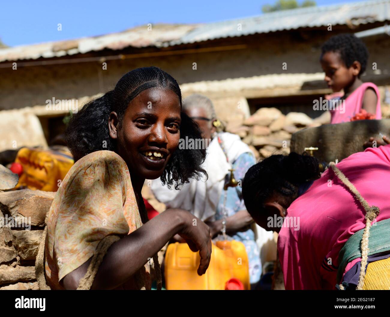 Local Tigrayans filling jerrycans of water in their village water pump ...