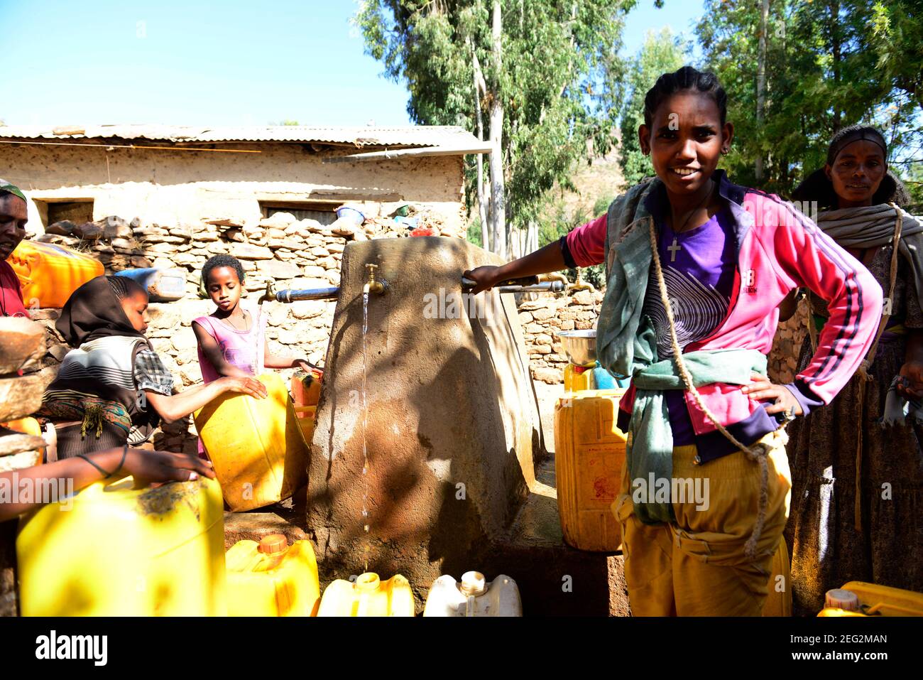 Local Tigrayans filling jerrycans of water in their village water pump ...