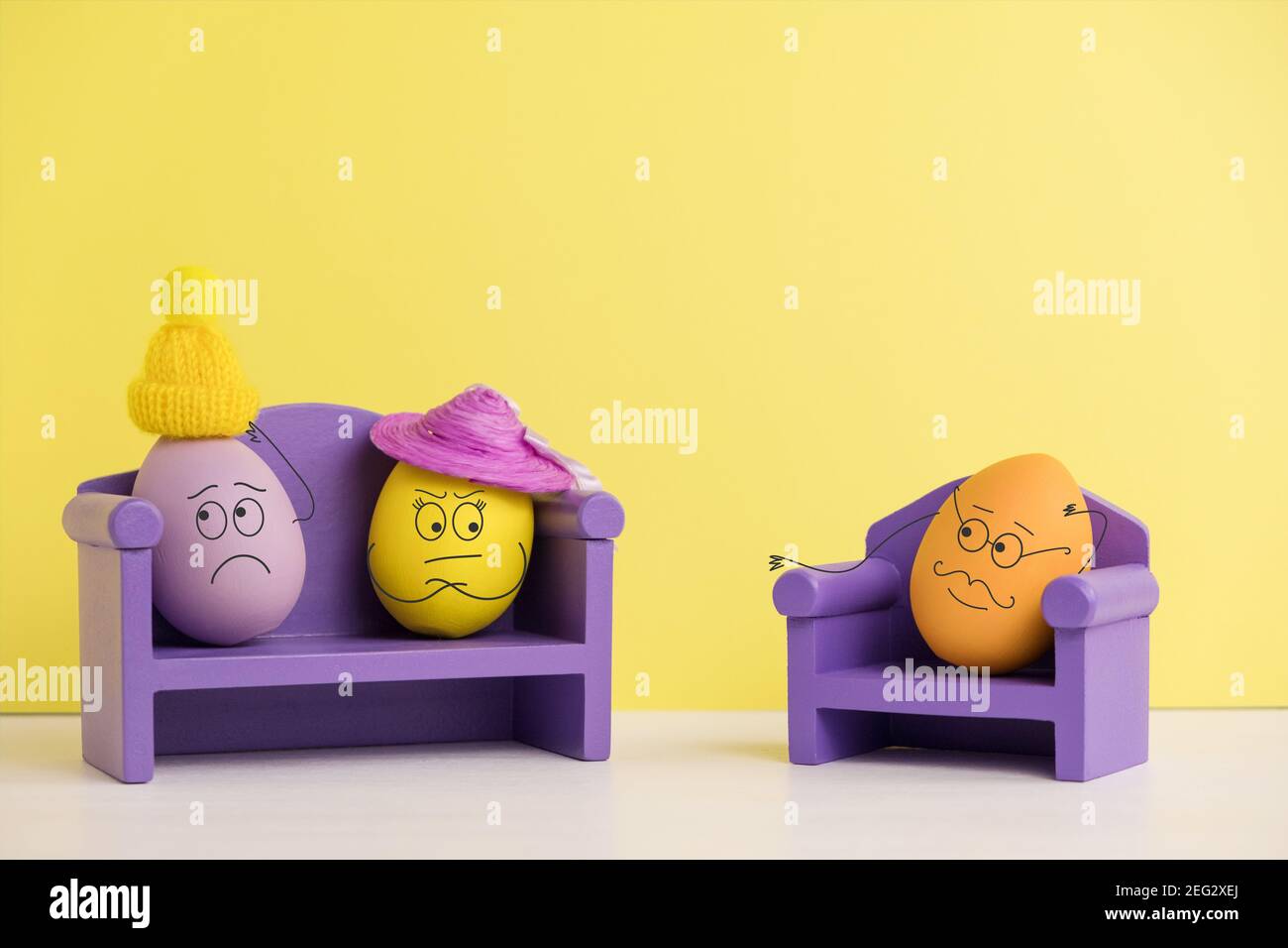 Couple at a psychologist. Easter holiday concept with cute eggs with ...