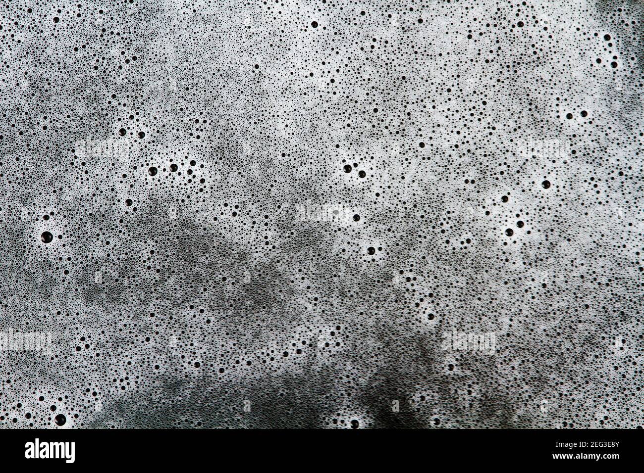 Detail of a dark water surface with plenty of bubbles Stock Photo - Alamy