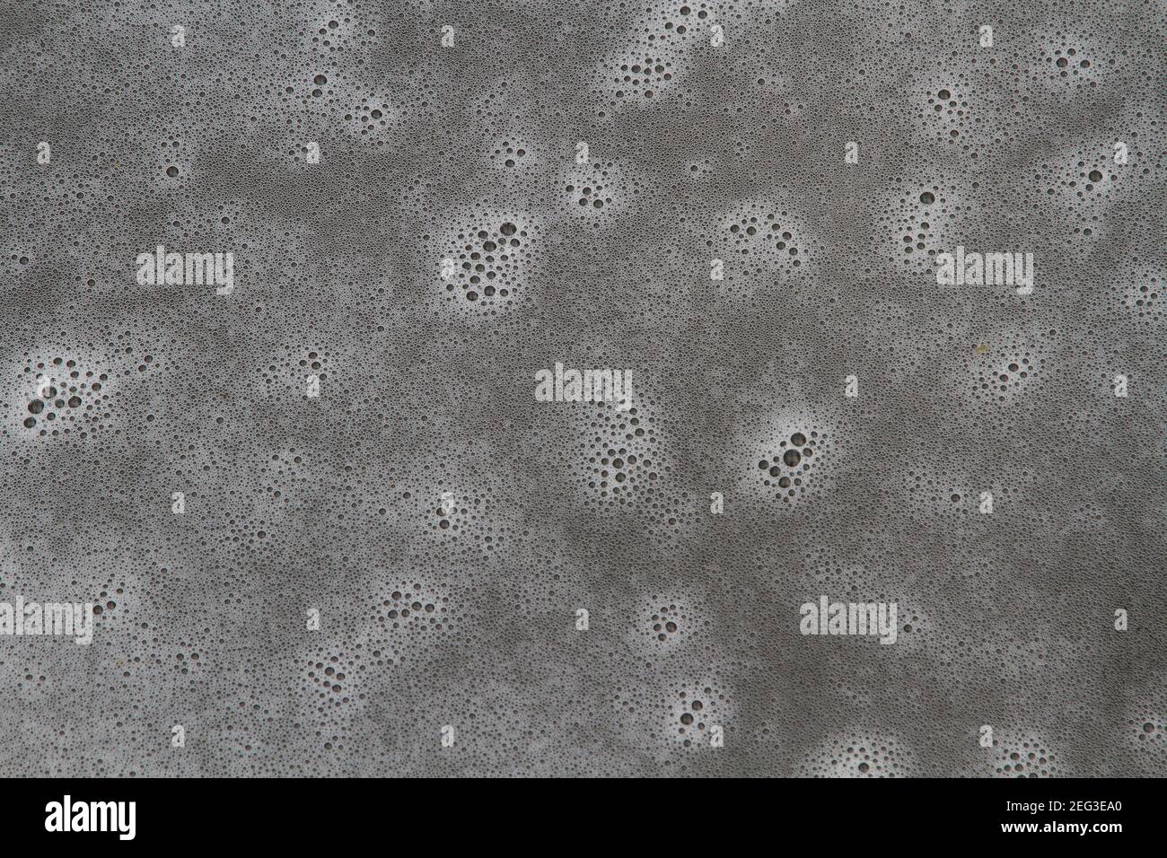 Detail of a dark water surface with plenty of bubbles Stock Photo - Alamy