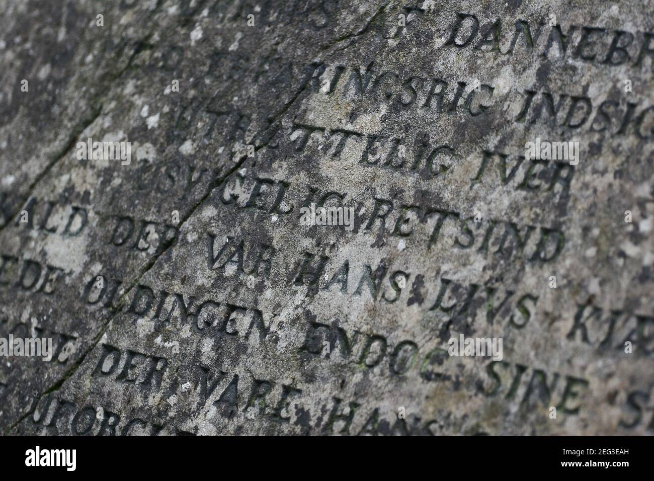 Detail closeup of a gravestone in a forest in Hoersholm denmark Stock ...