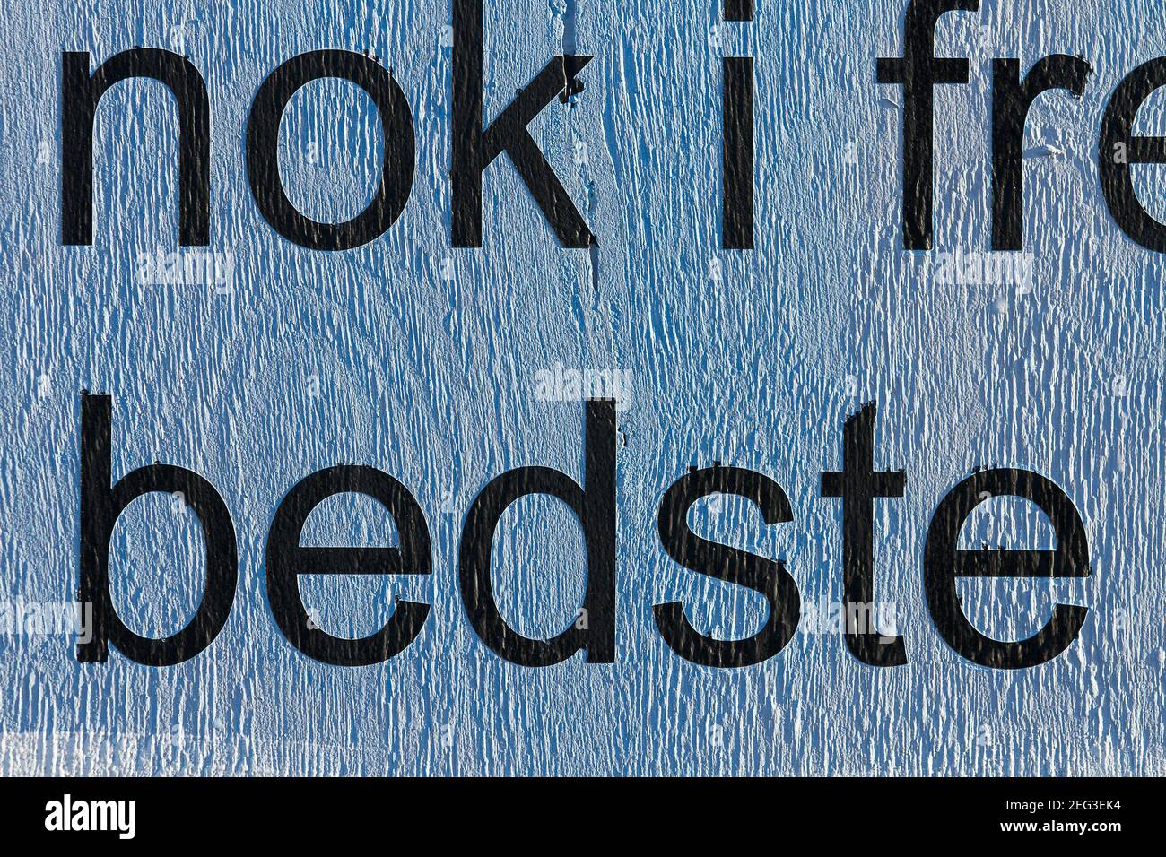 Detail - closeup of a Writing on a blue wall in a village in Denmark ...