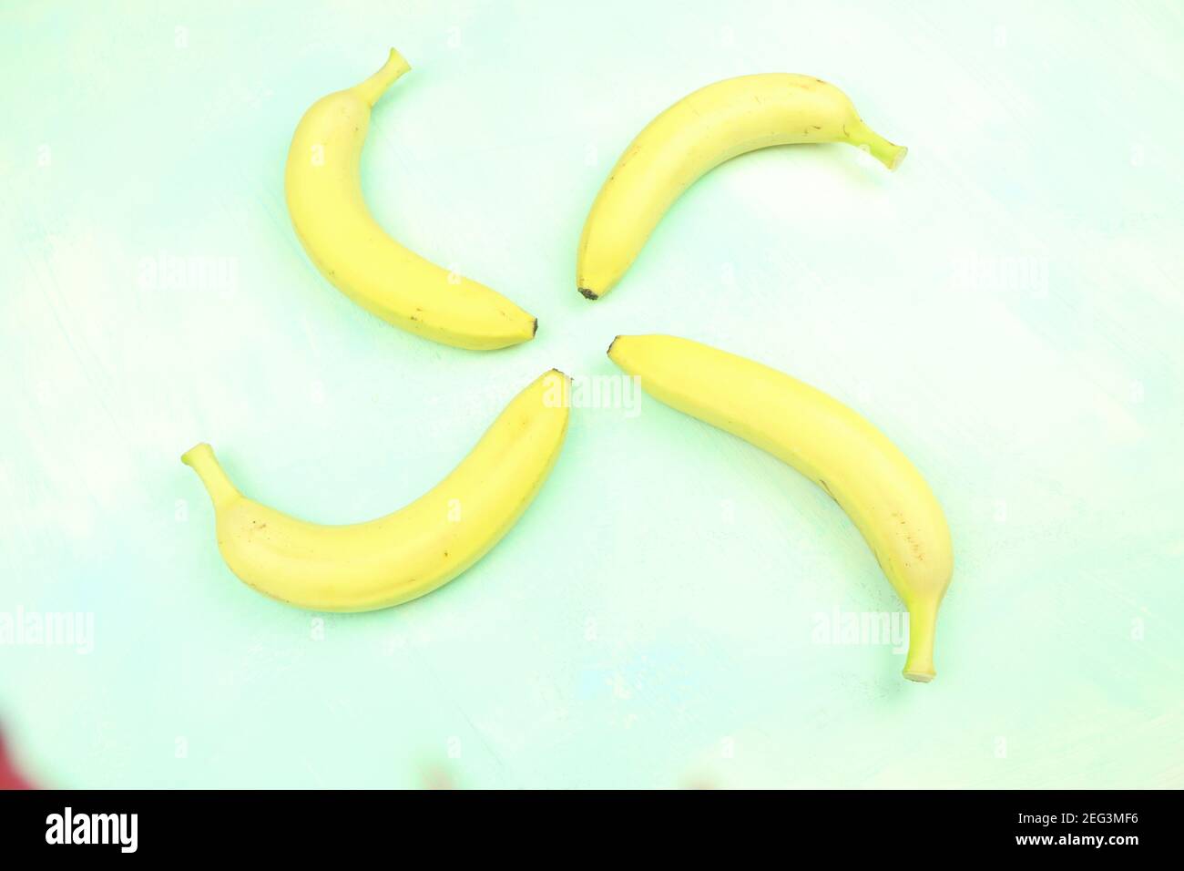 ripe little banana on a white background Stock Photo - Alamy