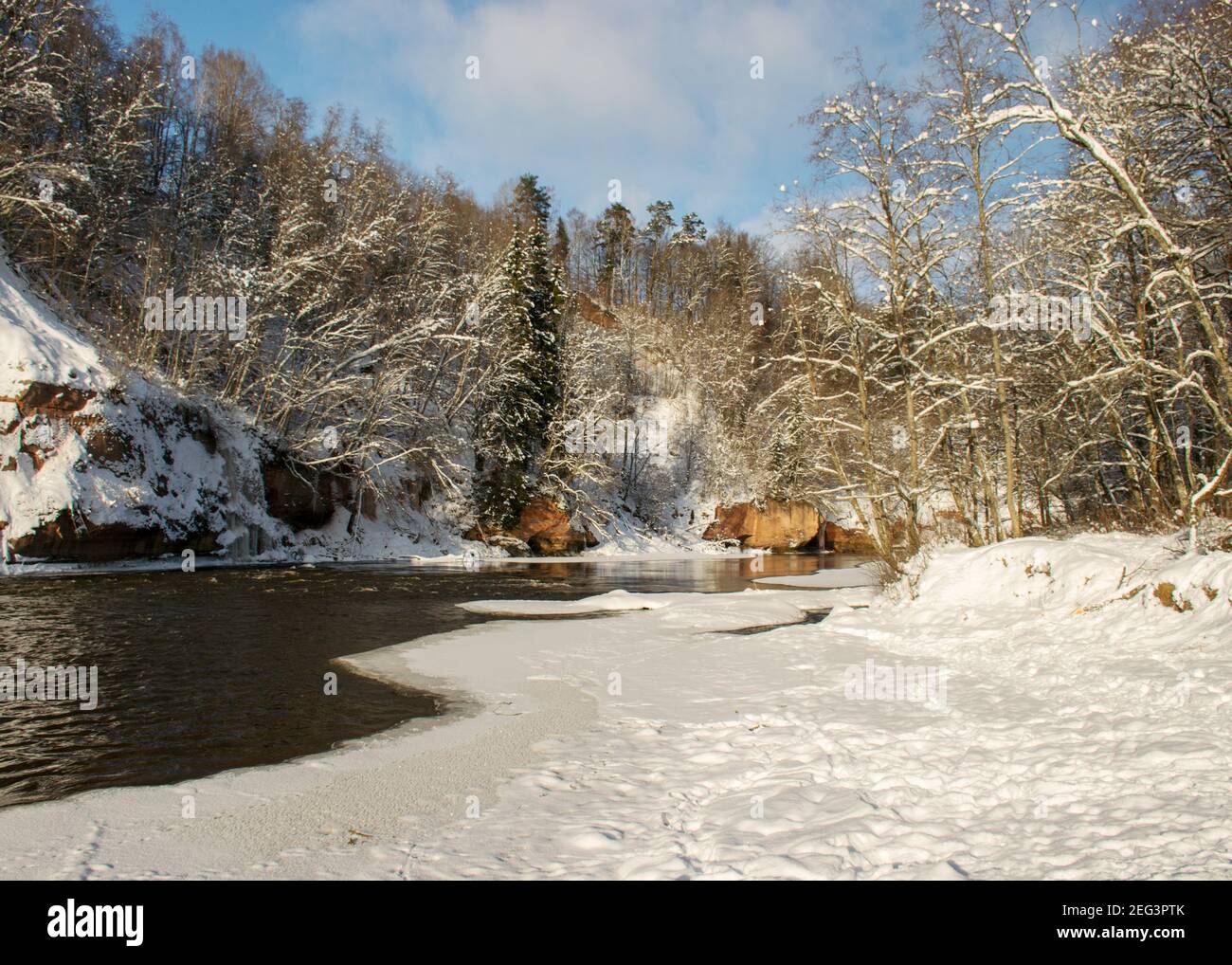 beautiful sunny day, landscape with red sandstone cliffs that are snowy ...