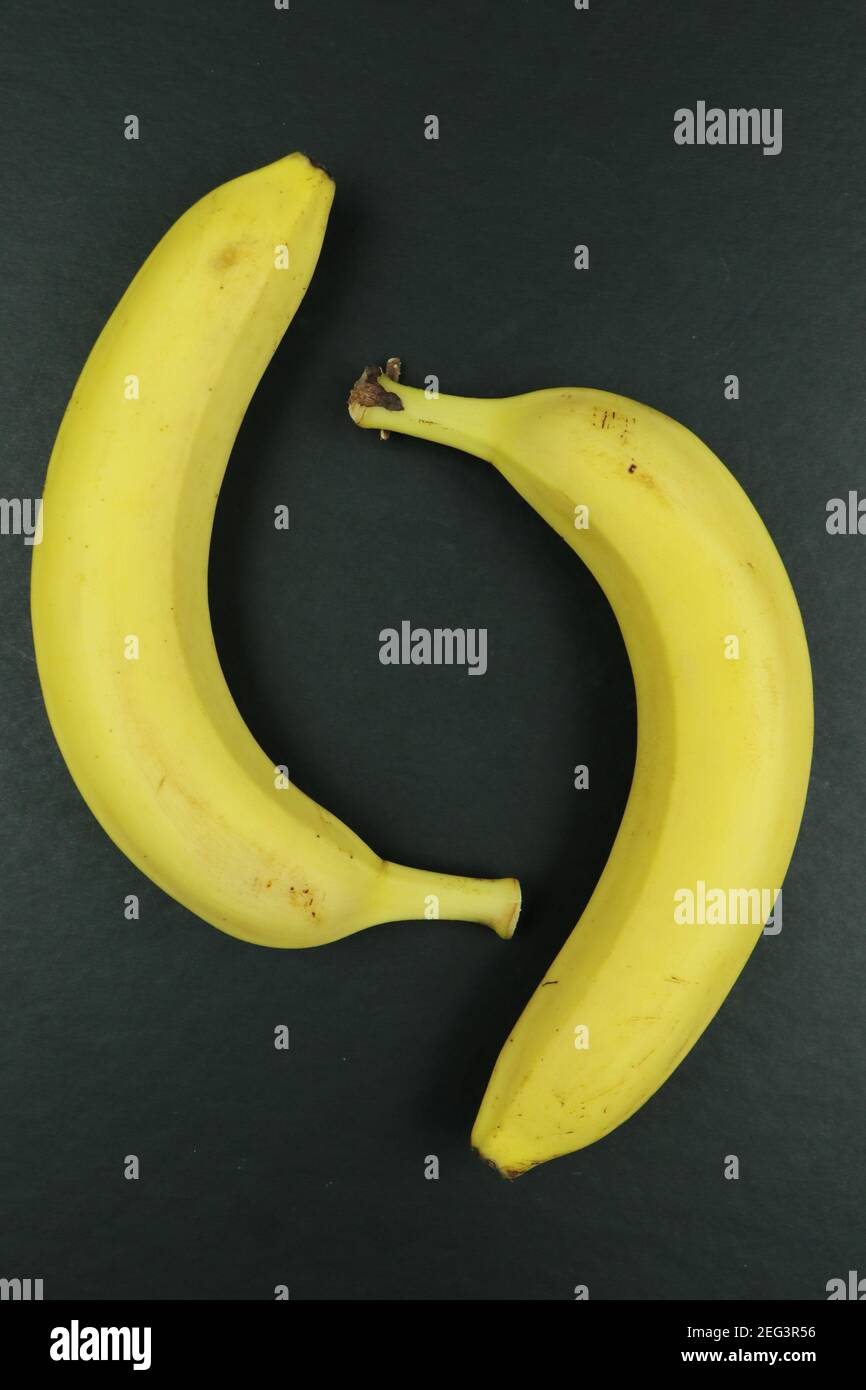 ripe little banana on a white background Stock Photo - Alamy
