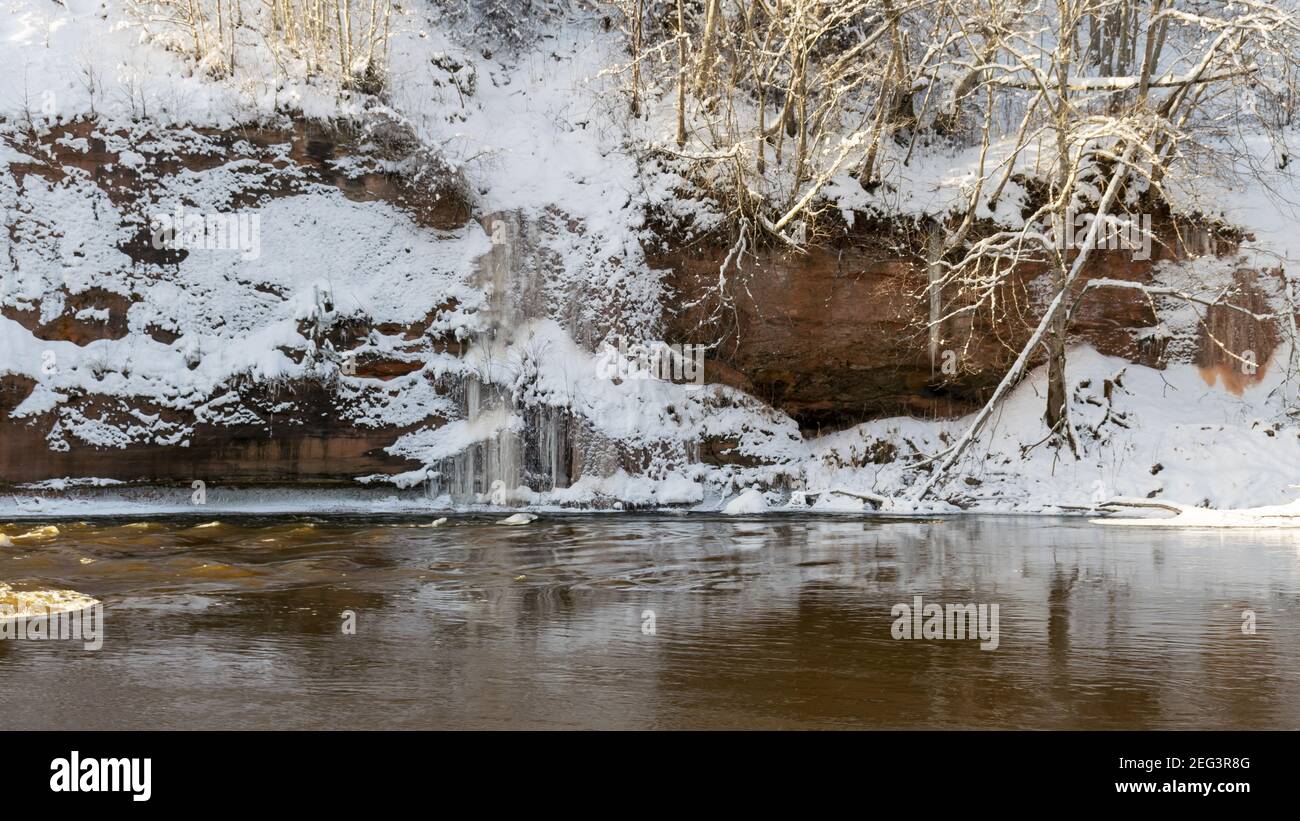 beautiful sunny day, landscape with red sandstone cliffs that are snowy ...