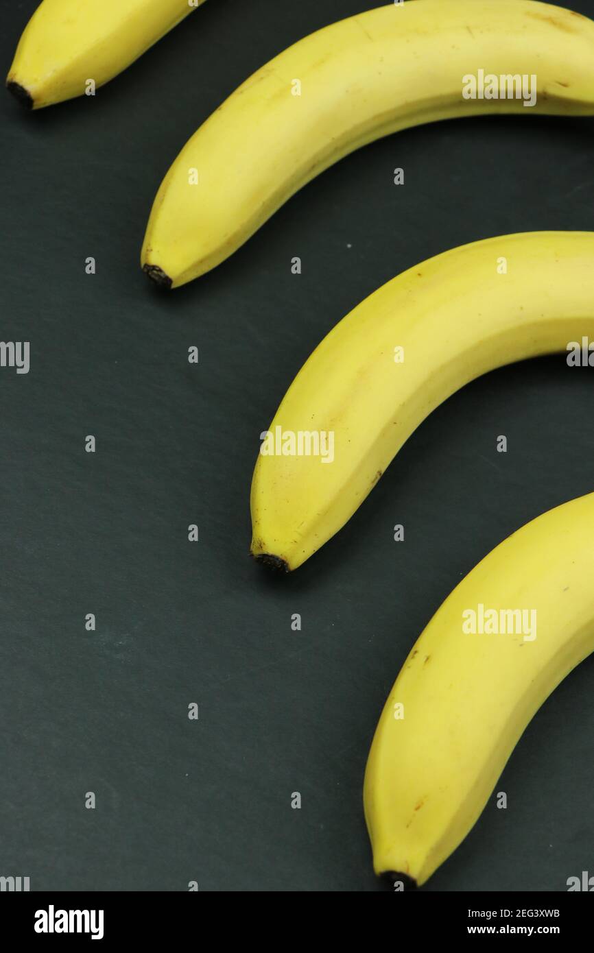 ripe little banana on a white background Stock Photo - Alamy