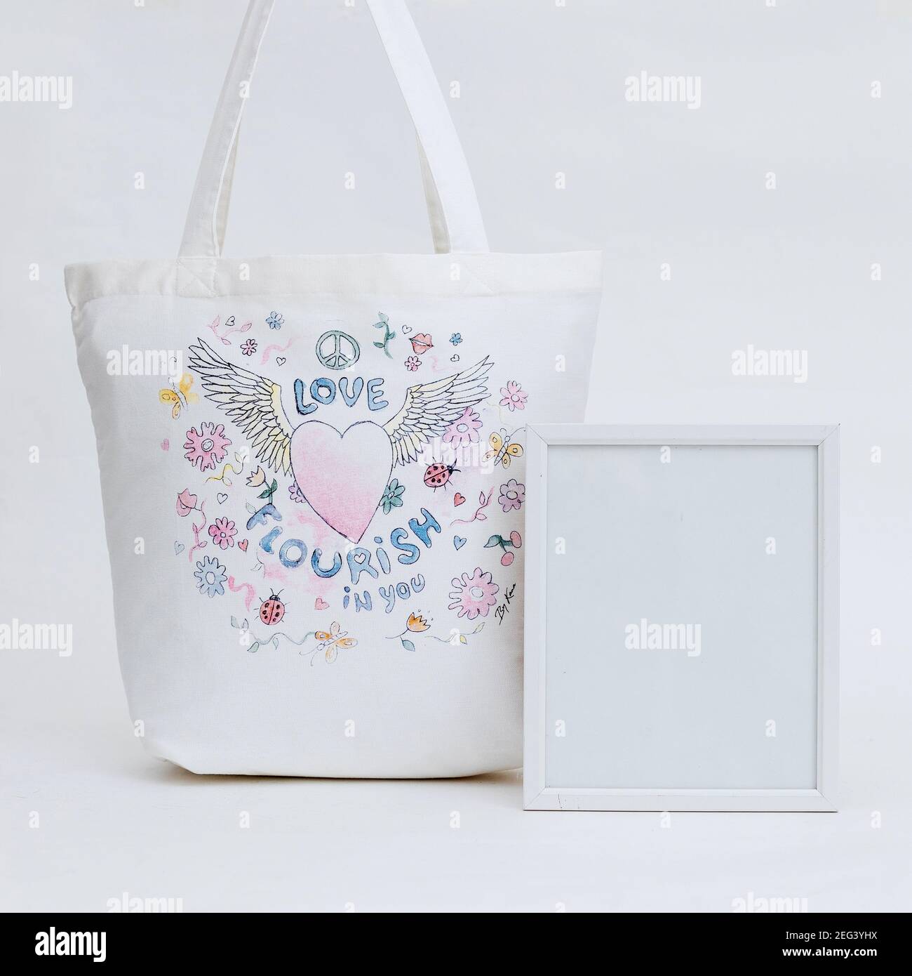 Closeup shot of a decorative textile bag with a frame isolated on white ...