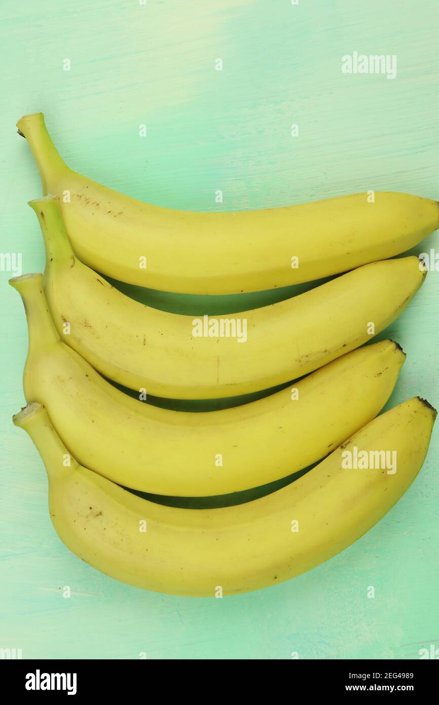 ripe little banana on a white background Stock Photo - Alamy