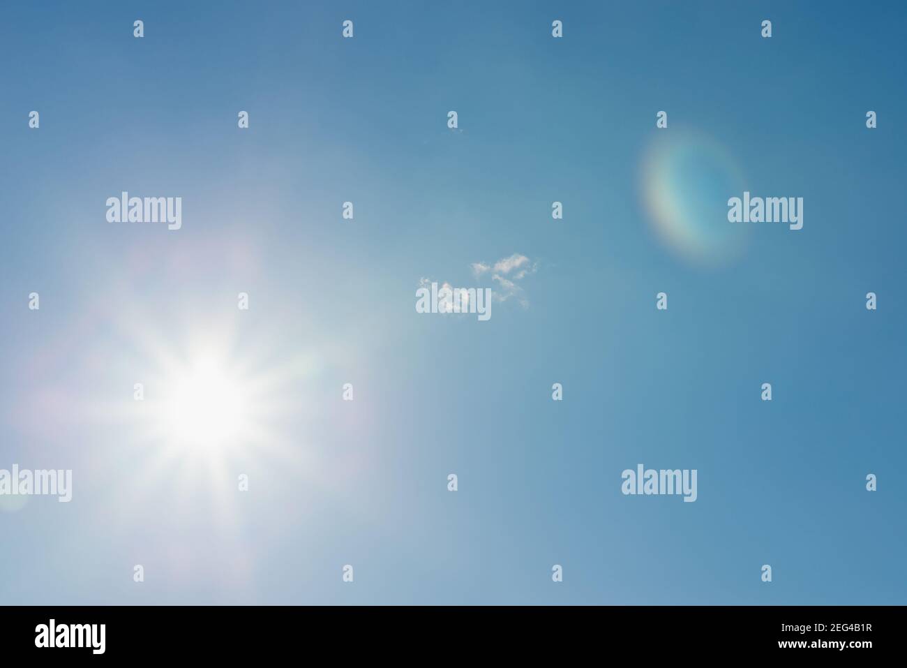 Bright blue sky with sun causing lens flare.Nice heaven background ...