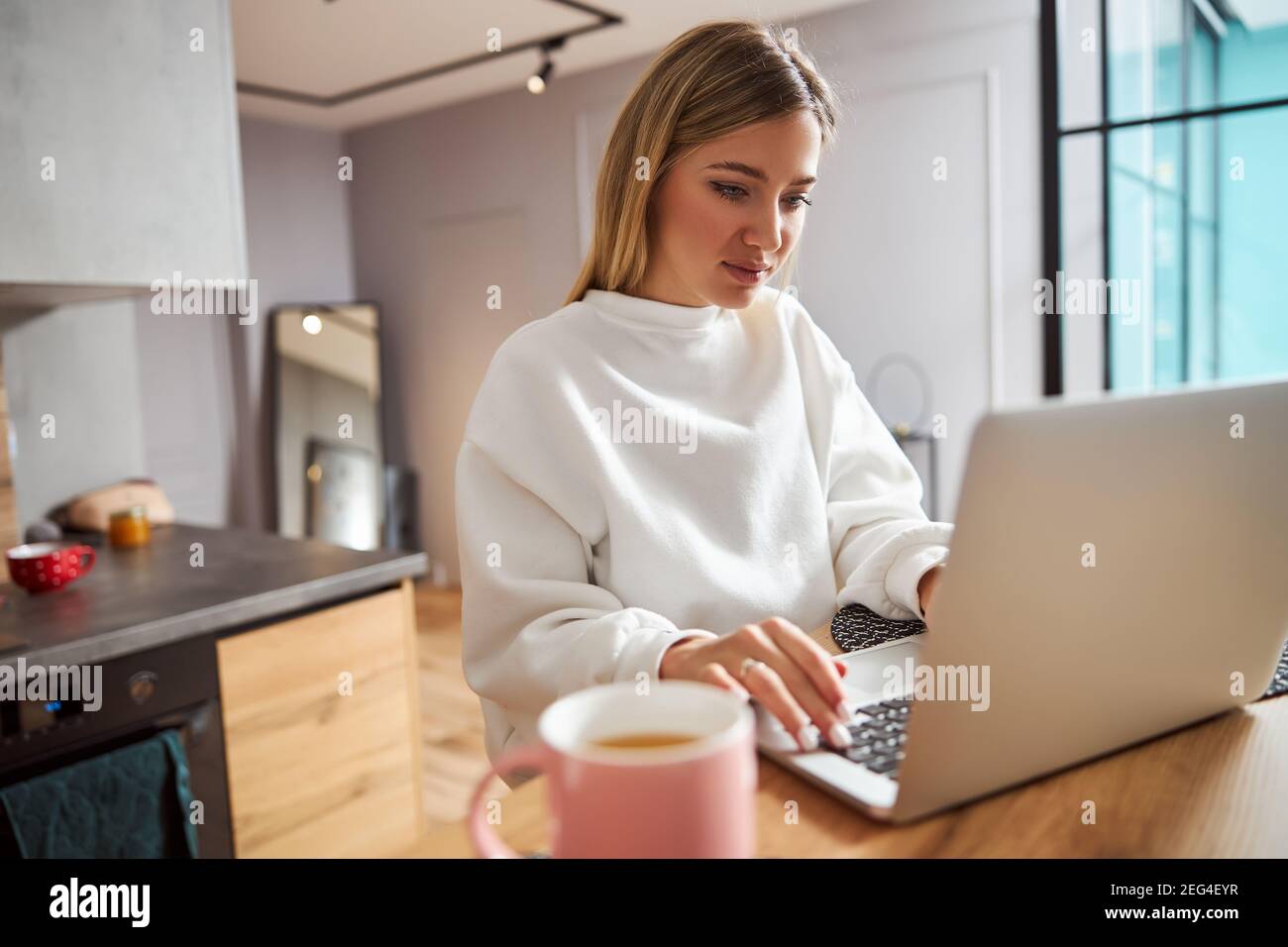 Beautiful young woman pressing laptop hi-res stock photography and ...