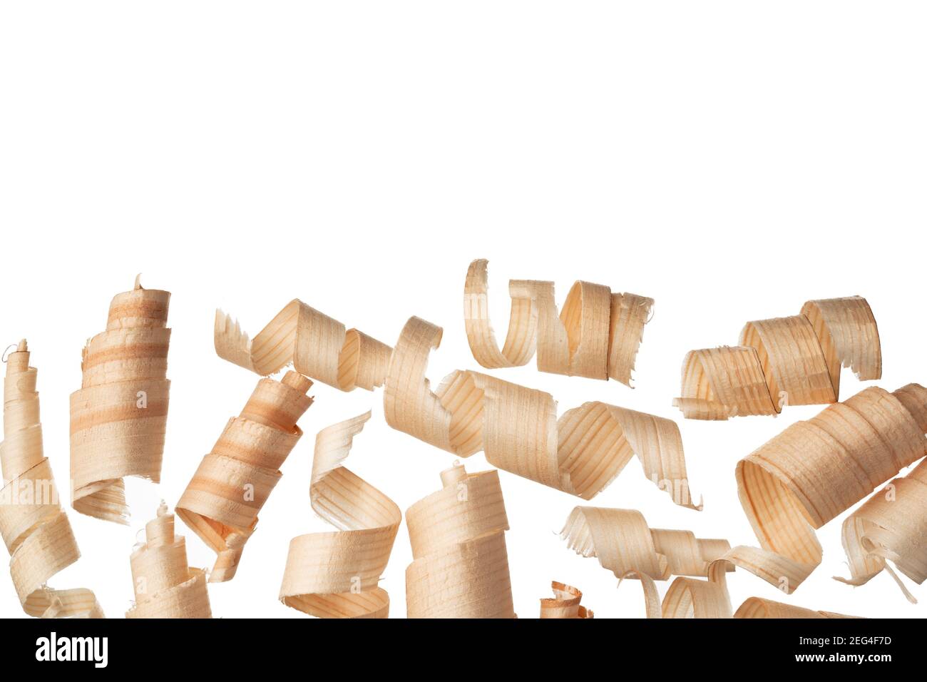 Wood shavings curls isolated on white background Stock Photo - Alamy
