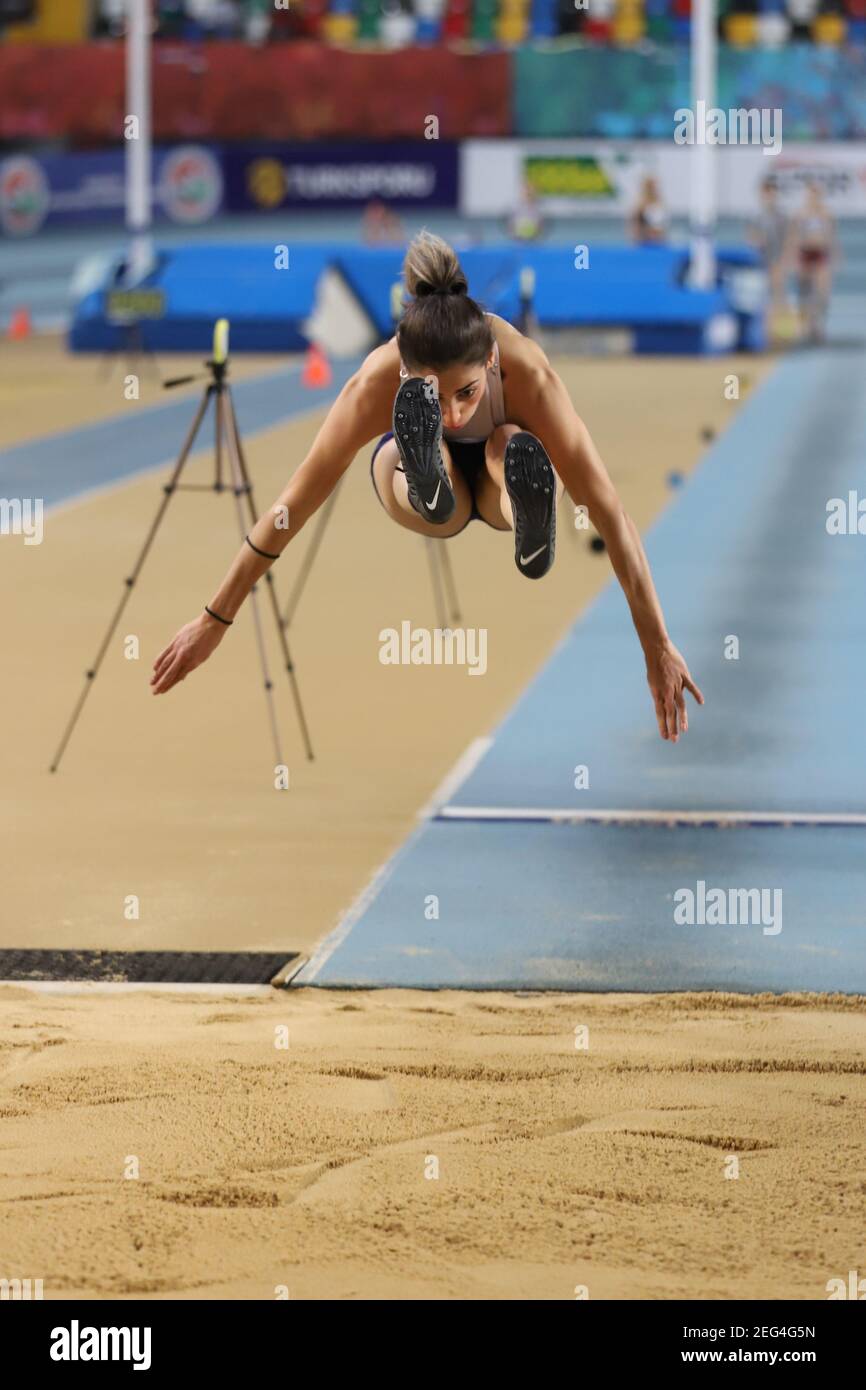 ISTANBUL, TURKEY - FEBRUARY 06, 2021: Undefined athlete long jumping ...