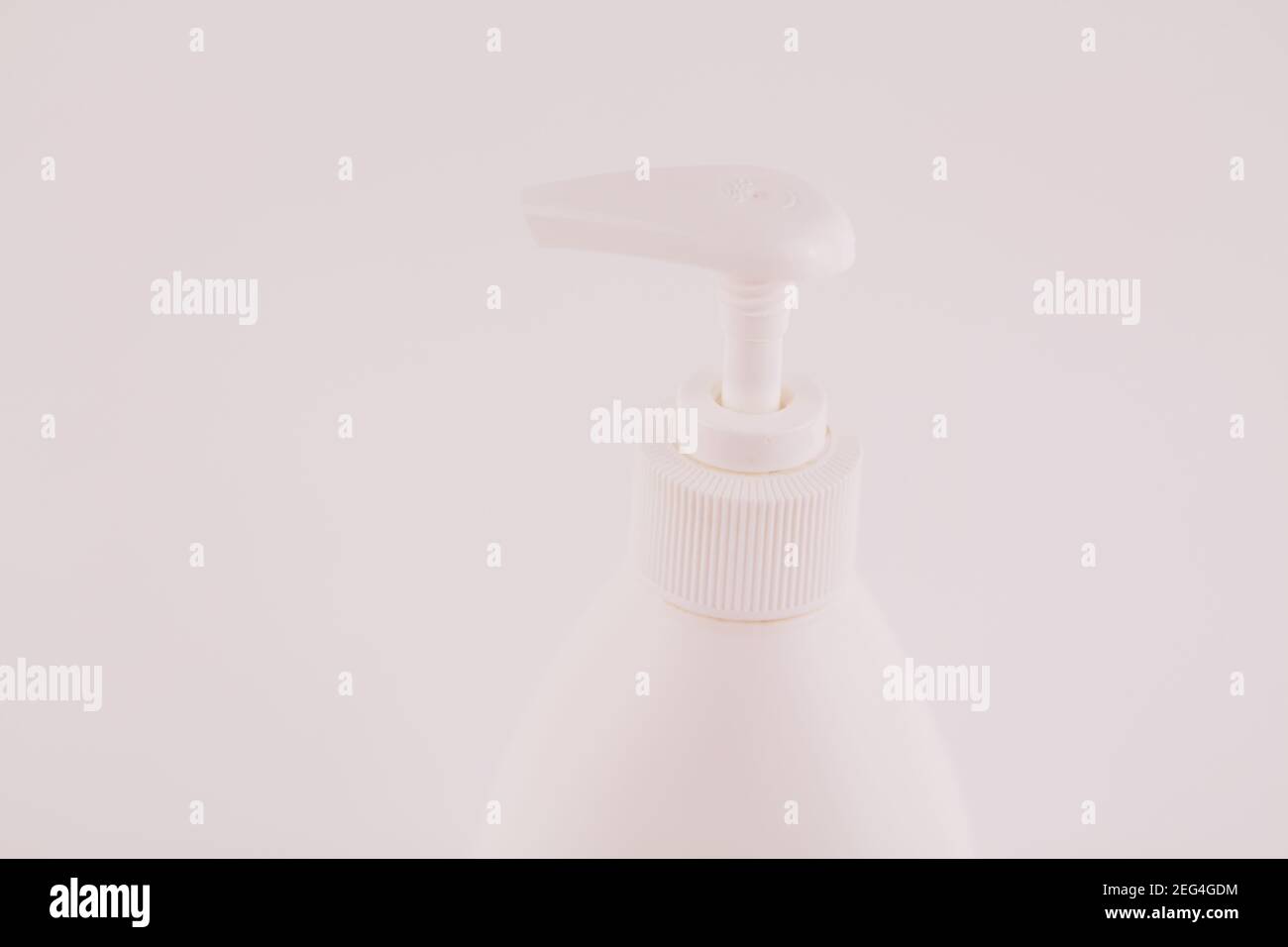 a container for cream with a dispenser on a white background Stock ...