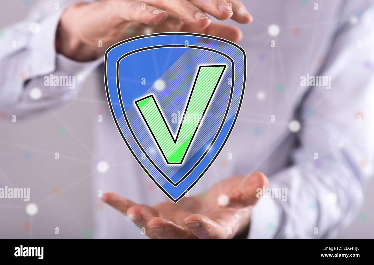 Security approval concept between hands of a man in background Stock ...