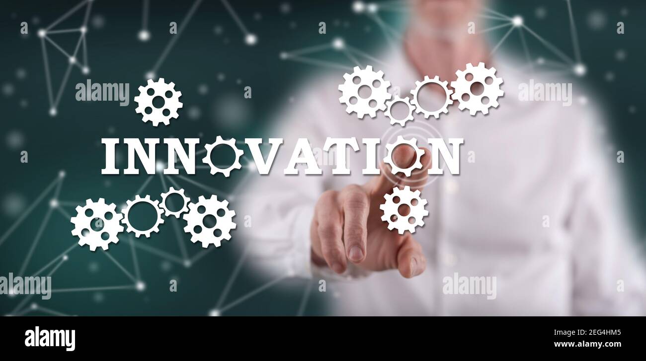 Man touching an innovation concept on a touch screen with his finger ...