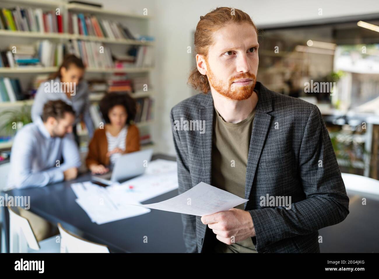 Group business partners sharing ideas hi-res stock photography and ...