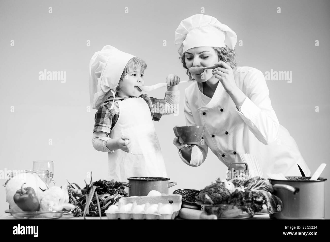 Mother teaches son to cook. Cooking with child kid concept Stock Photo ...