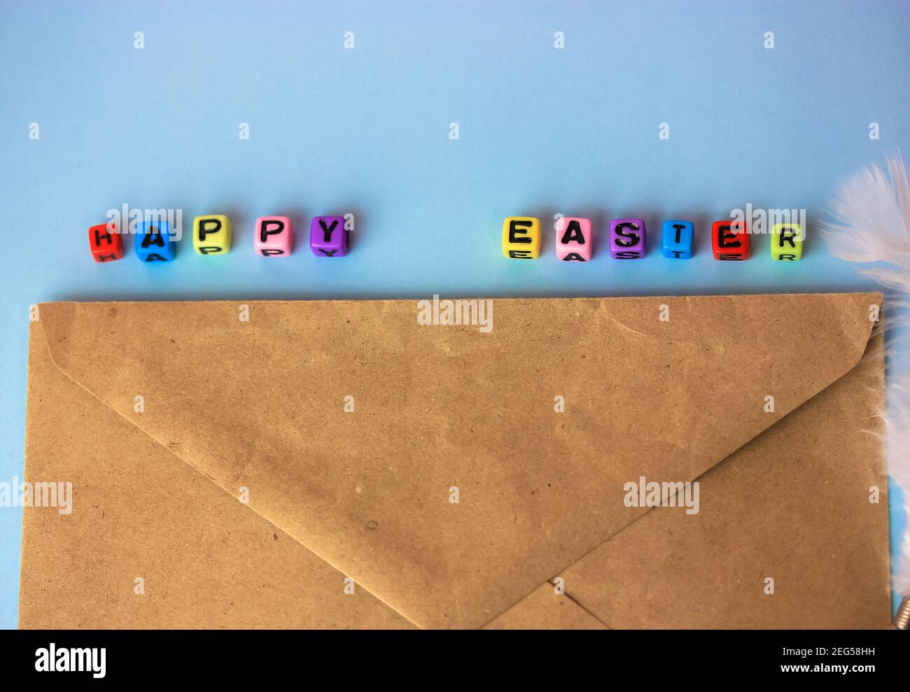 Happy Easter lettering text made of multicolored wooden letters, brown ...