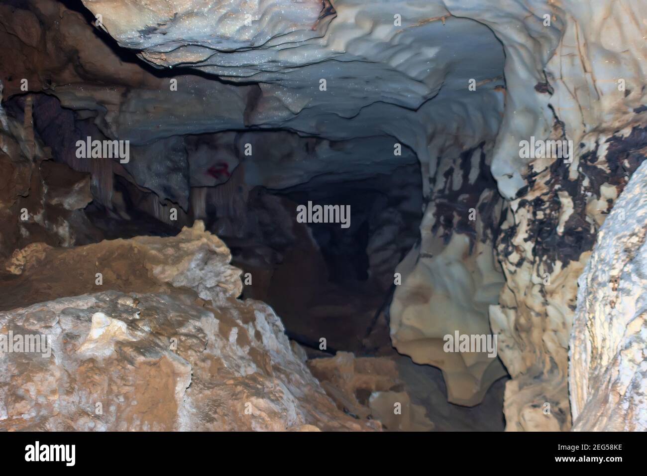 Speleology. Old cave washed by an underground river in the mountain ...