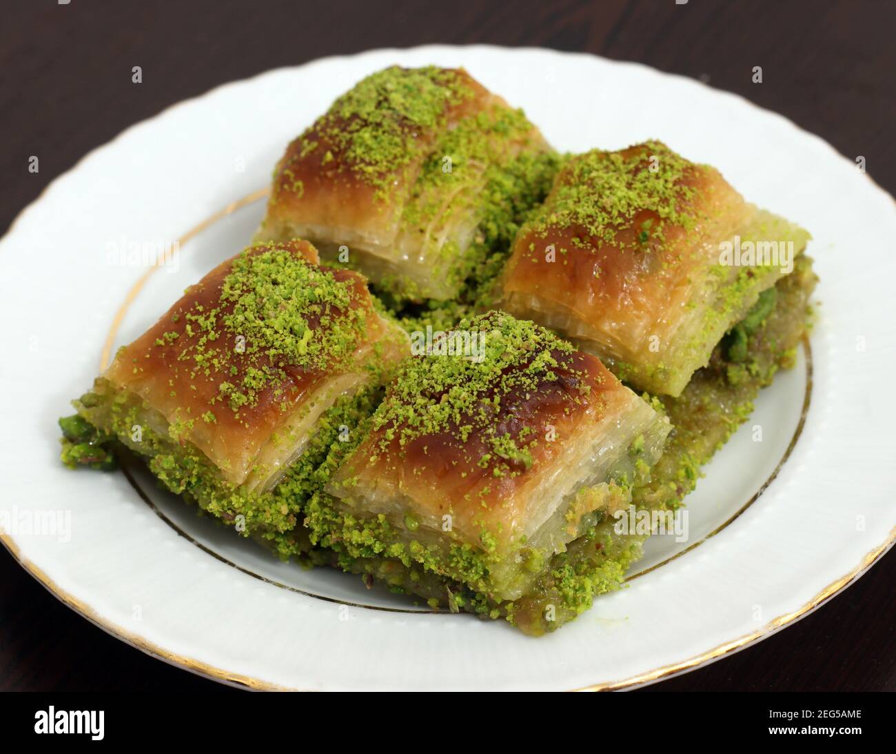 Traditional Turkish dessert Antep Baklava with pistachio on rustic ...